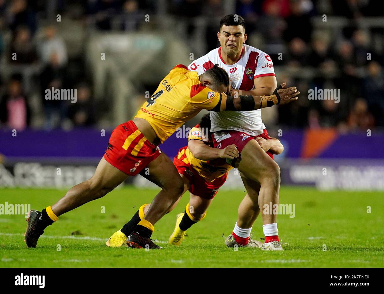 Tonga’s Andrew Fifita is tackled by Papua New Guinea’s Justin Olam and ...