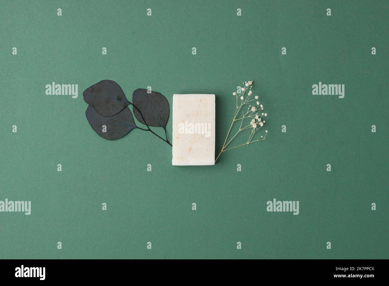 Soap with flowers on green background. Flat lay, copy space Stock Photo ...