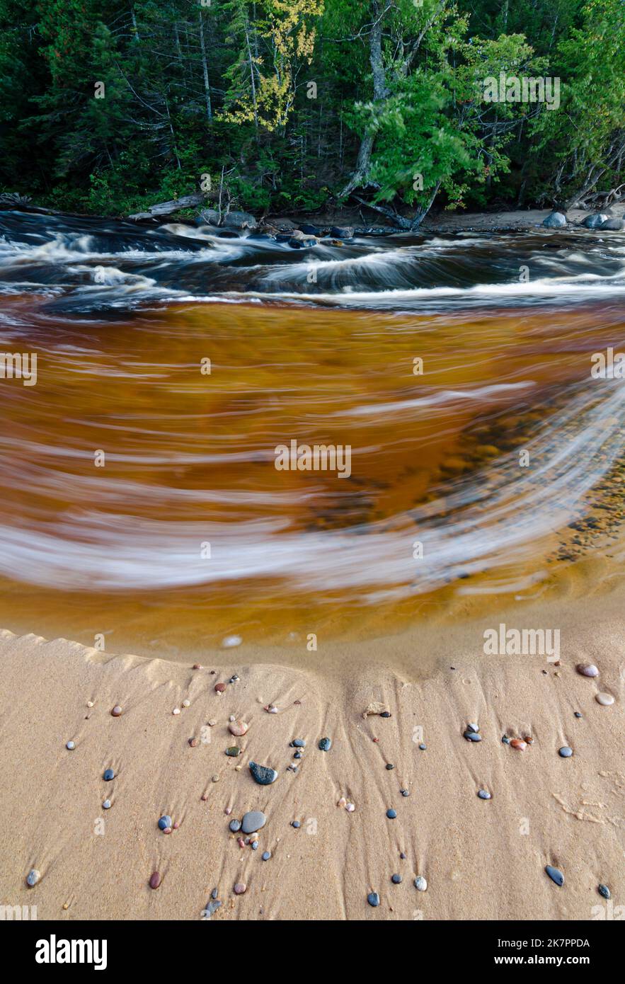 The Hurricane River swirls around a bend in the creek before it joins ...