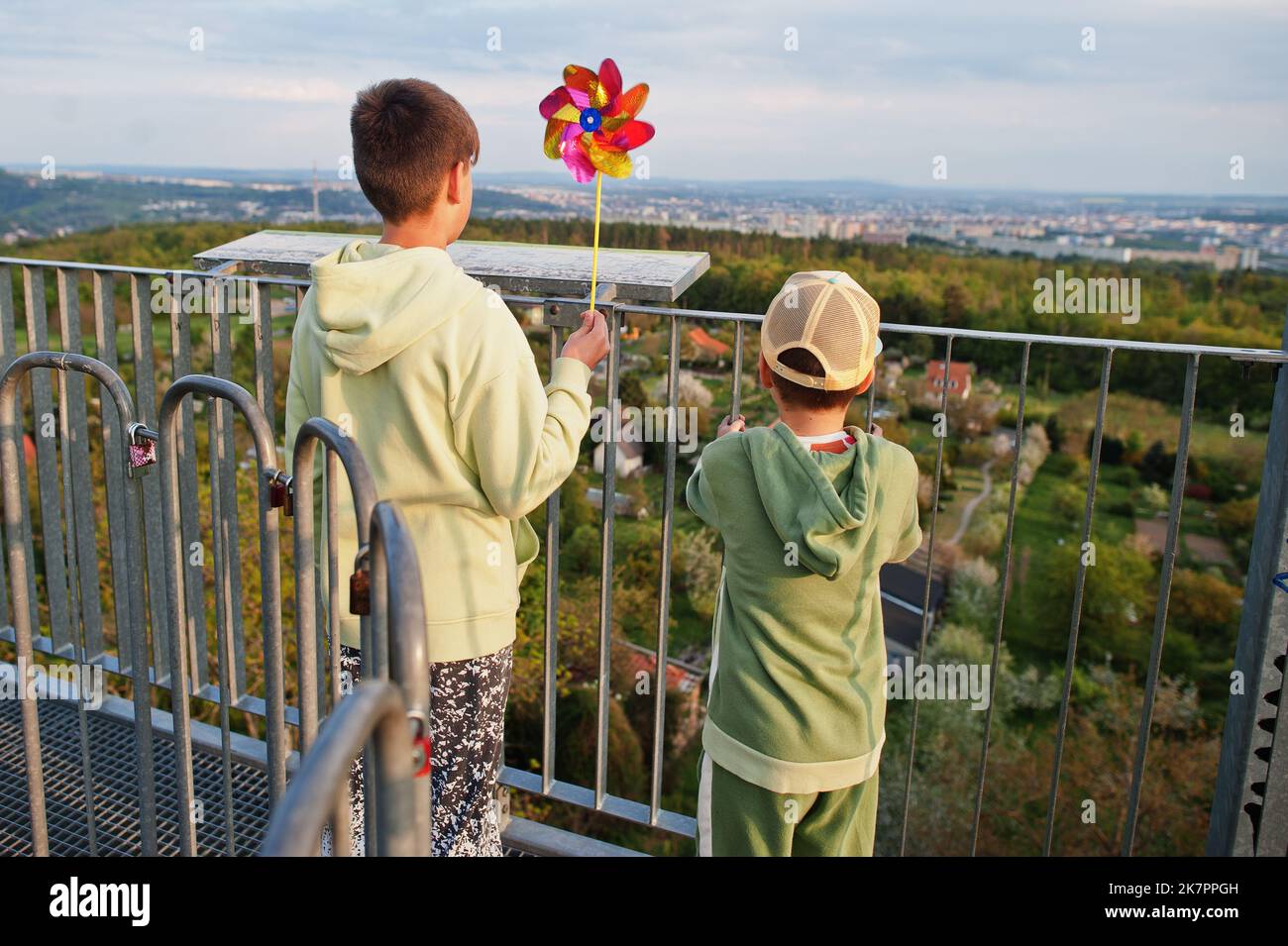 Boys with pinwheel at watch tower Stock Photo - Alamy