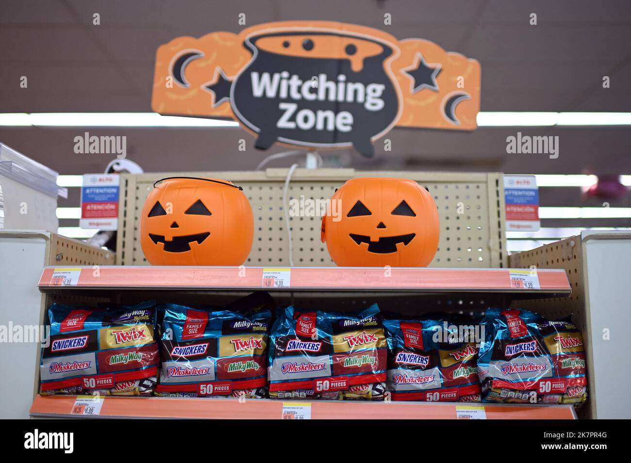 Halloween lanterns are set above a candy on display at a Walgreens ...