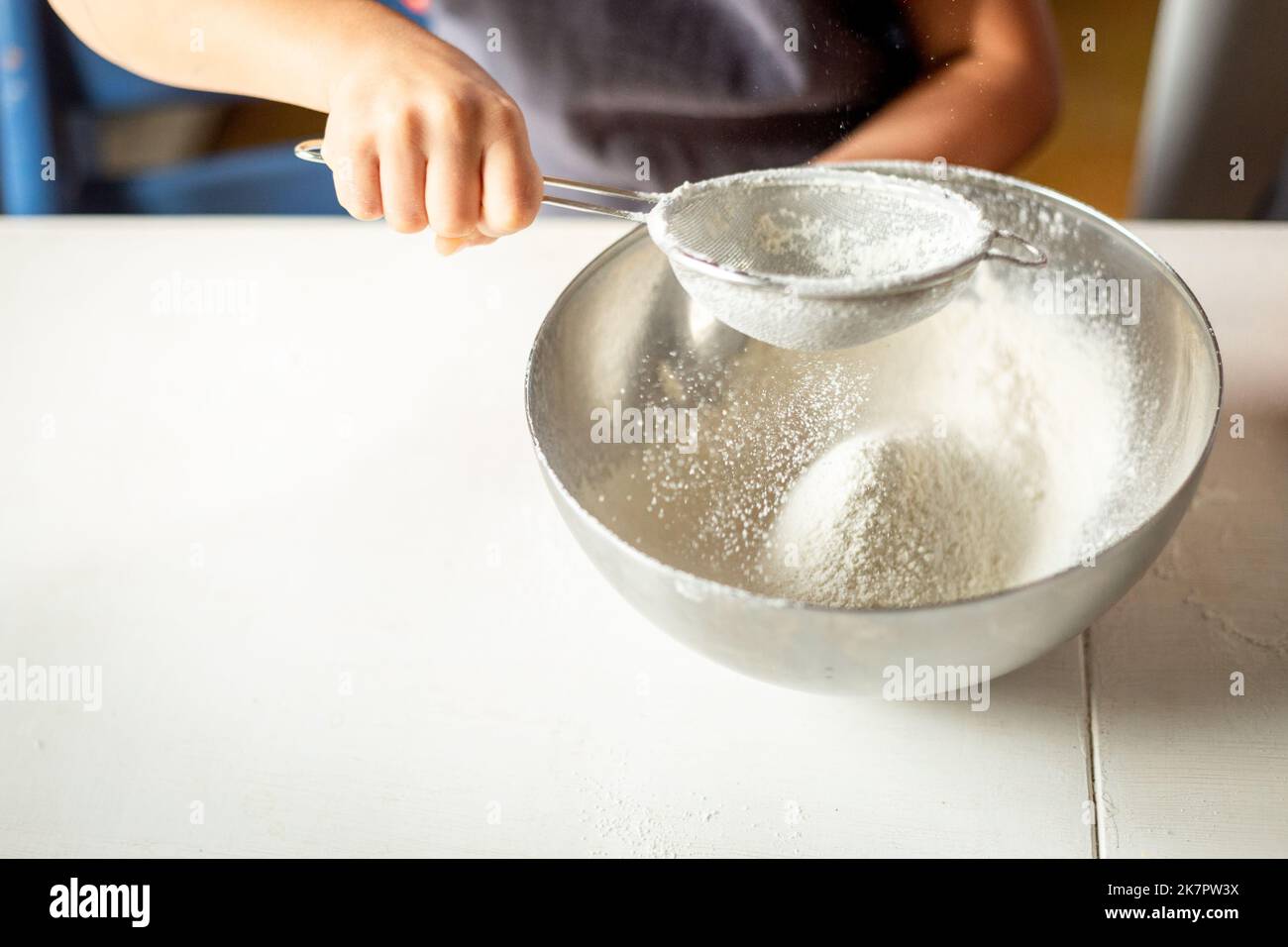 a close view of the hand of the child sifting flour Stock Photo - Alamy