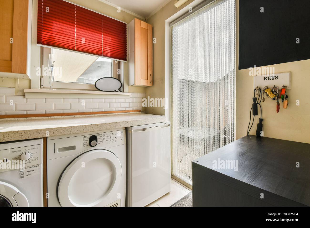 Boiler room of an apartment building with washing mechines. A small ...