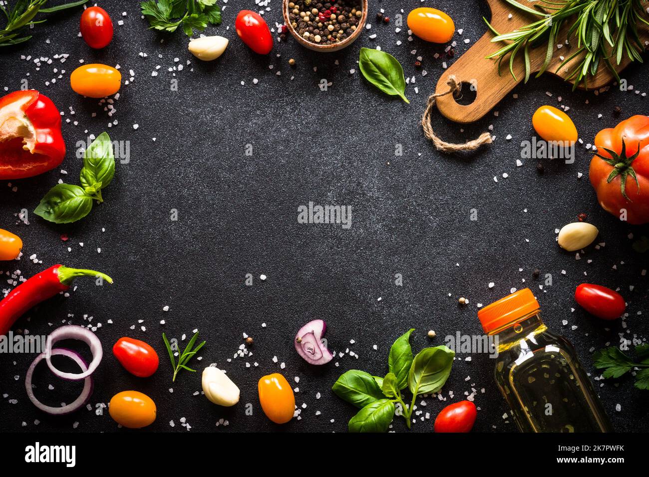 Food cooking background on black stone table Stock Photo - Alamy