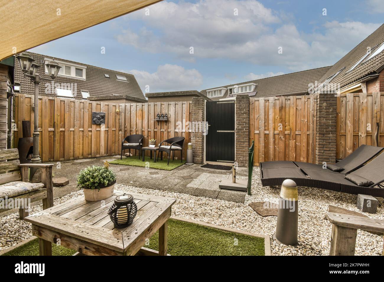 Simple small empty patio with near wooden fence Stock Photo - Alamy
