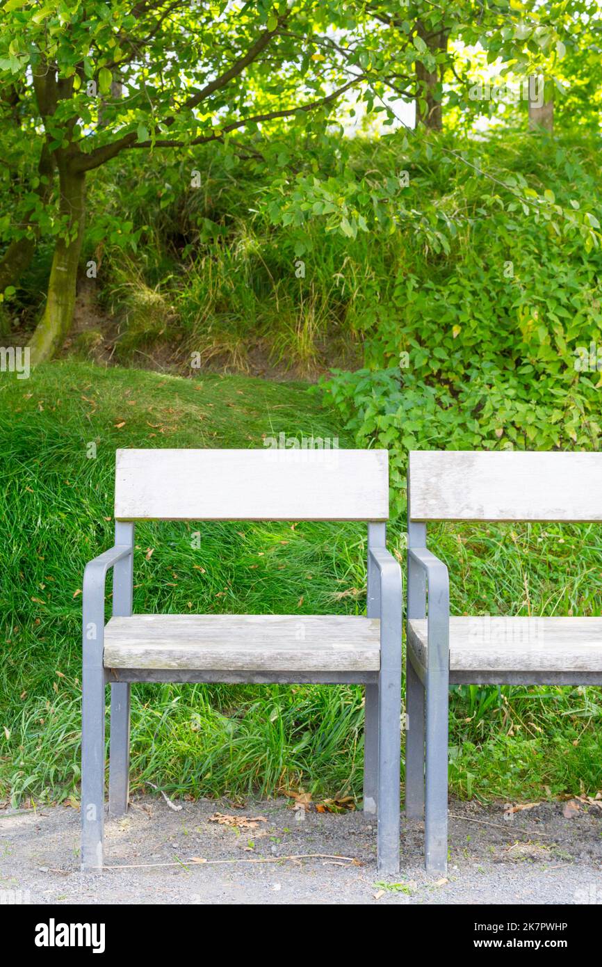 Modern wooden bench in Baakenpark, Hamburg which consists of individual ... Modern wooden bench in Baakenpark, Hamburg which consists of individual ...