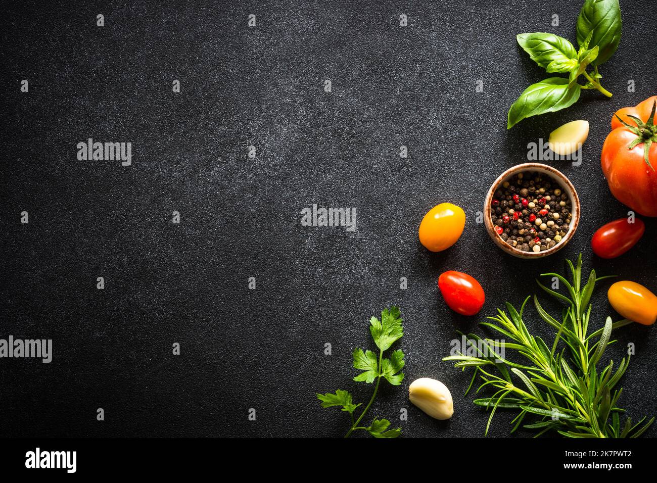 Food cooking background on black stone table Stock Photo - Alamy