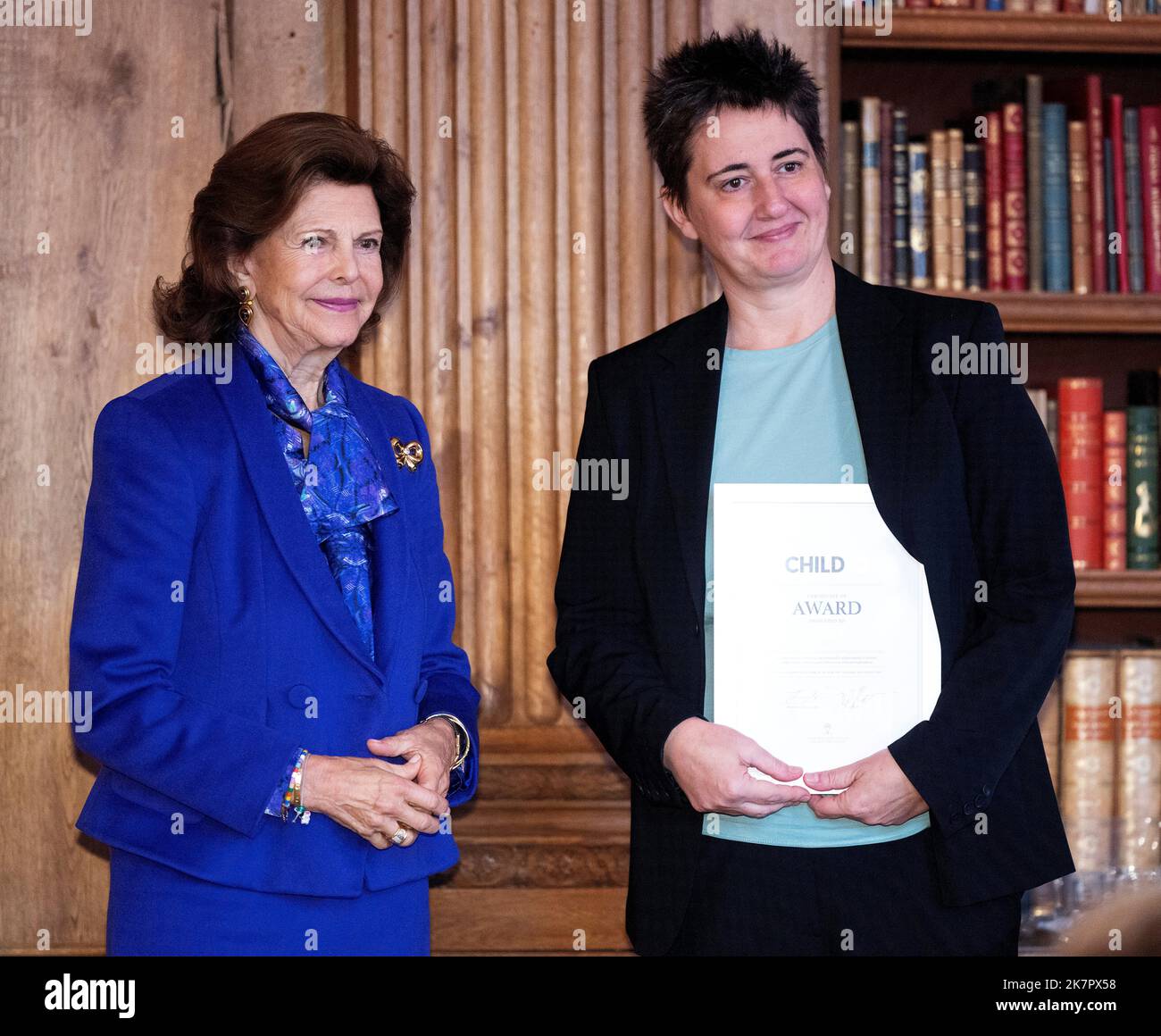 Marijana Savic from the organization Atina receives an award from Queen ...