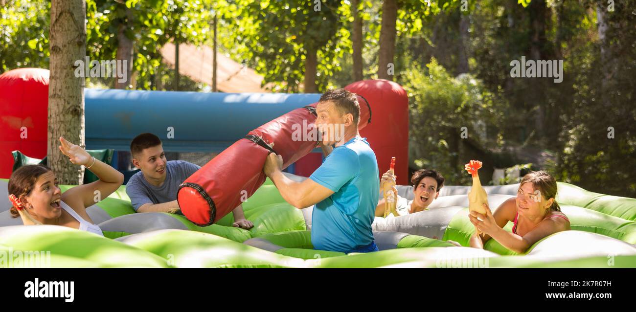 Happy people having fun in amusement park outdoors Stock Photo - Alamy