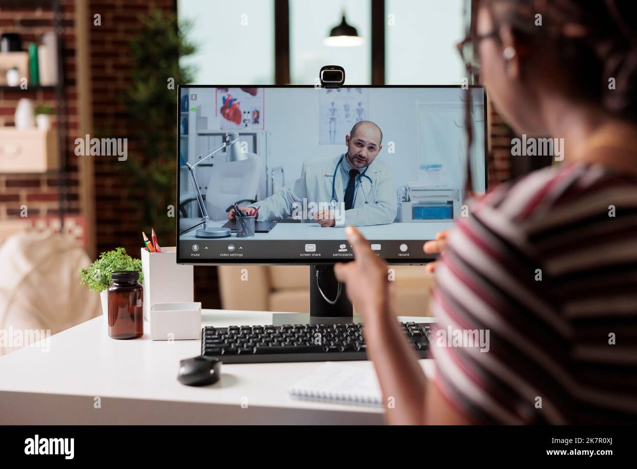 Patient talking with doctor on video call, telemedicine, online checkup ...