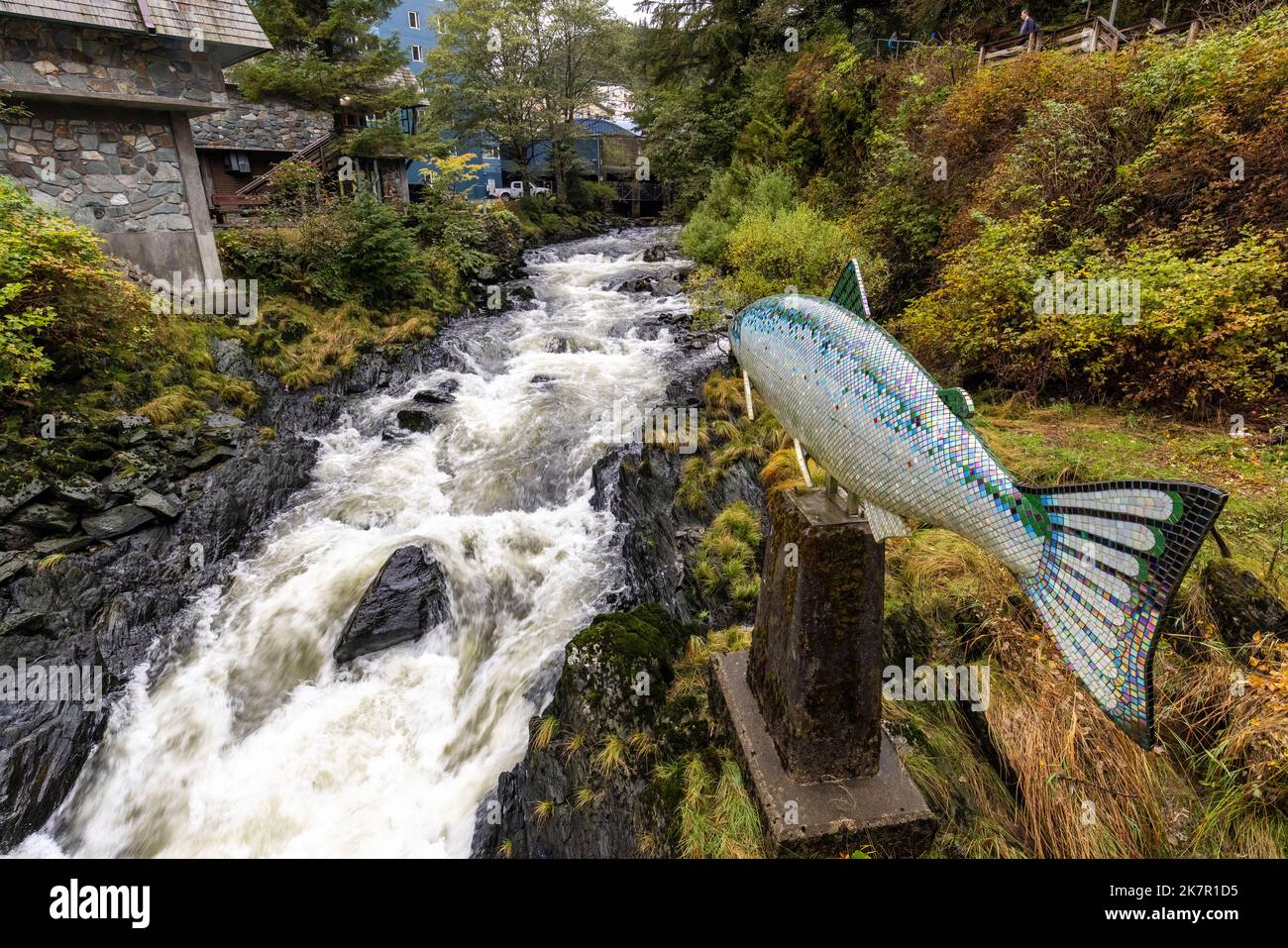 Salmon statue near Ketchikan Creek viewed from historic Creek Street in ...