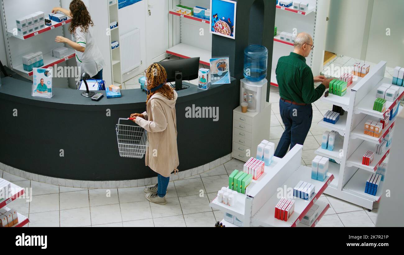 African american client buying pharmaceutical products and medicaments ...