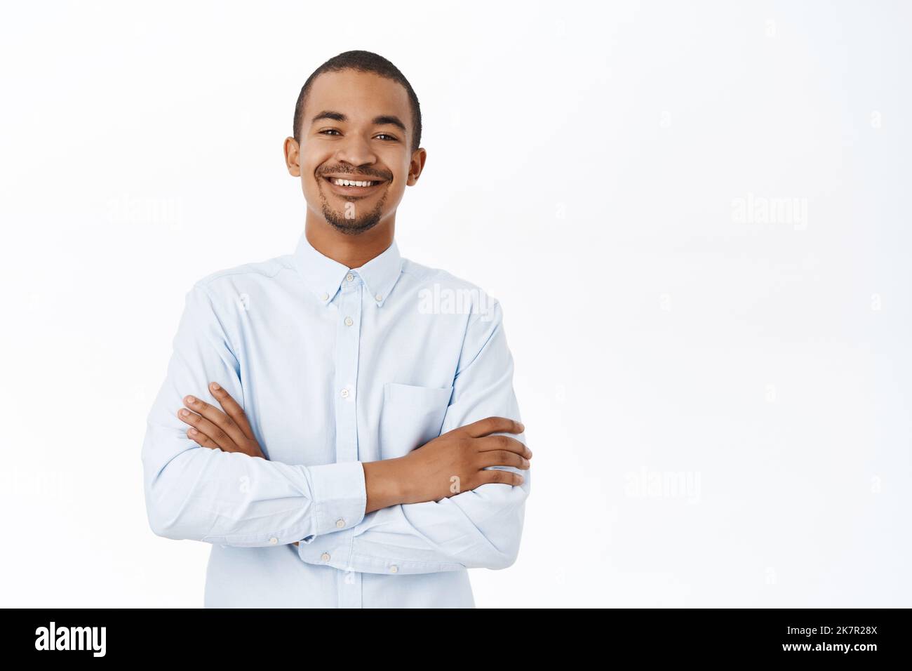 Confident arab man looking self-assured and professional, cross arms on ...