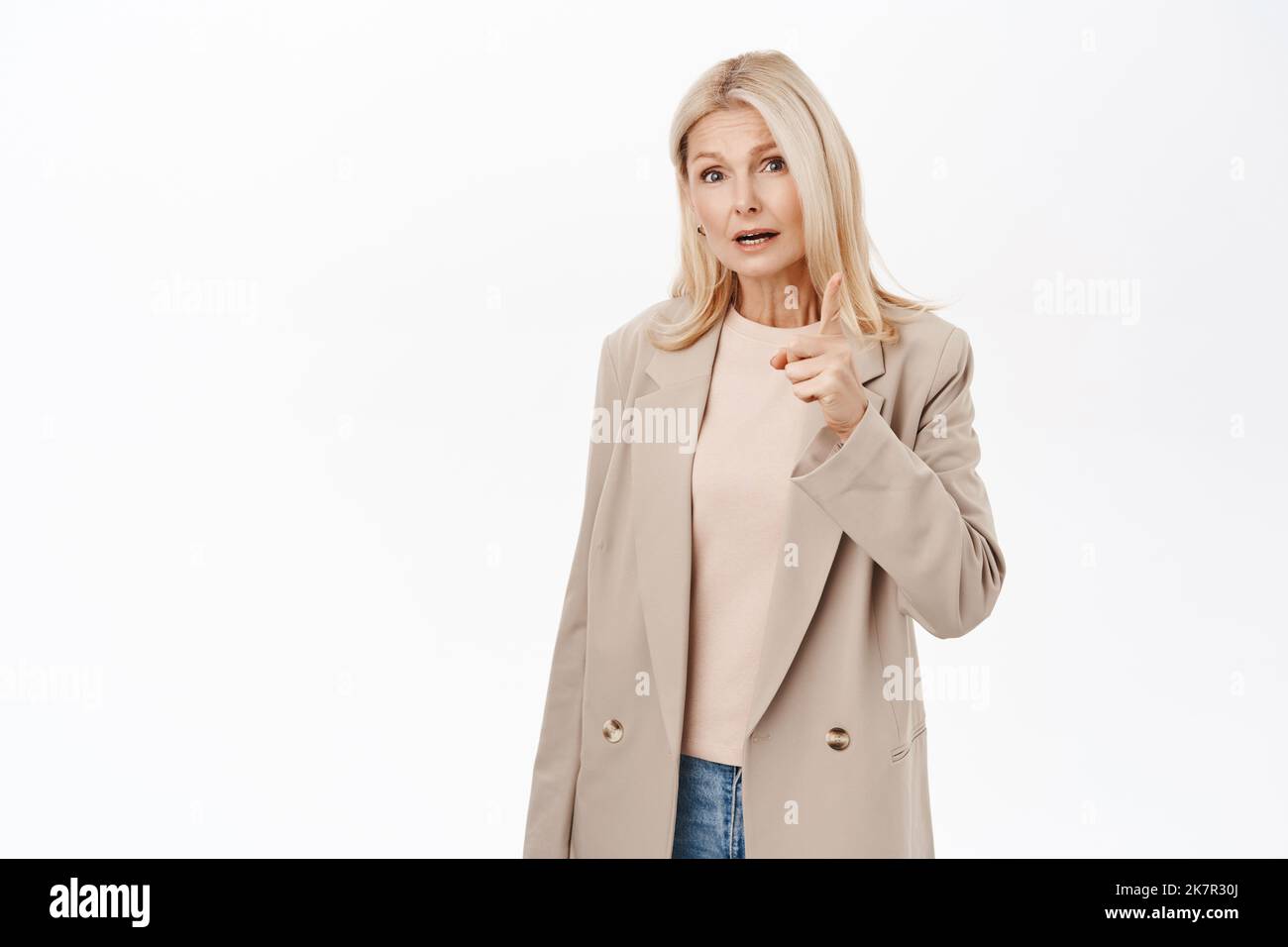 Senior woman, elegant lady shaking finger in disapproval, scolding bad ...