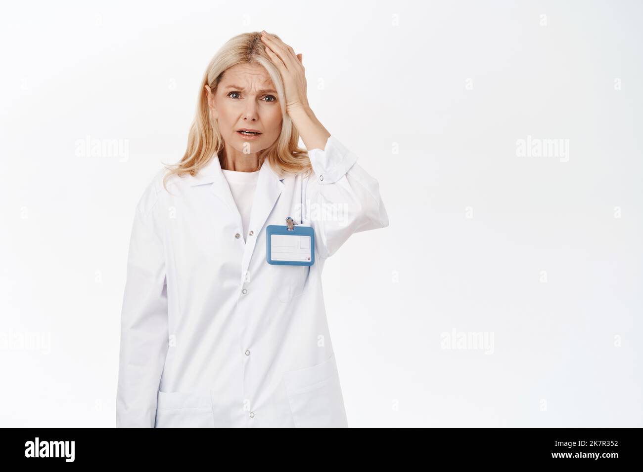 Portrait of lab worker, woman doctor holds hand on head and looks ...