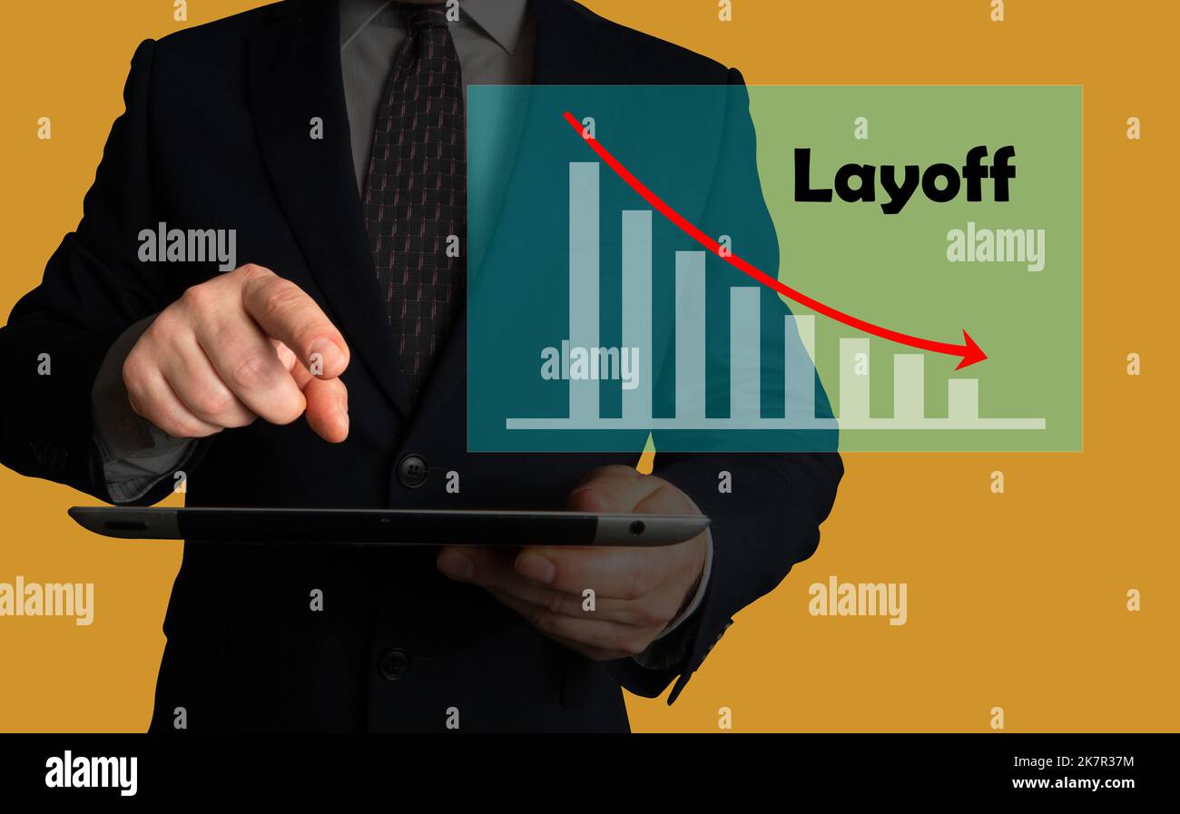 Layoff. Discharge. Businessman holding a tablet, and a screen showing ...