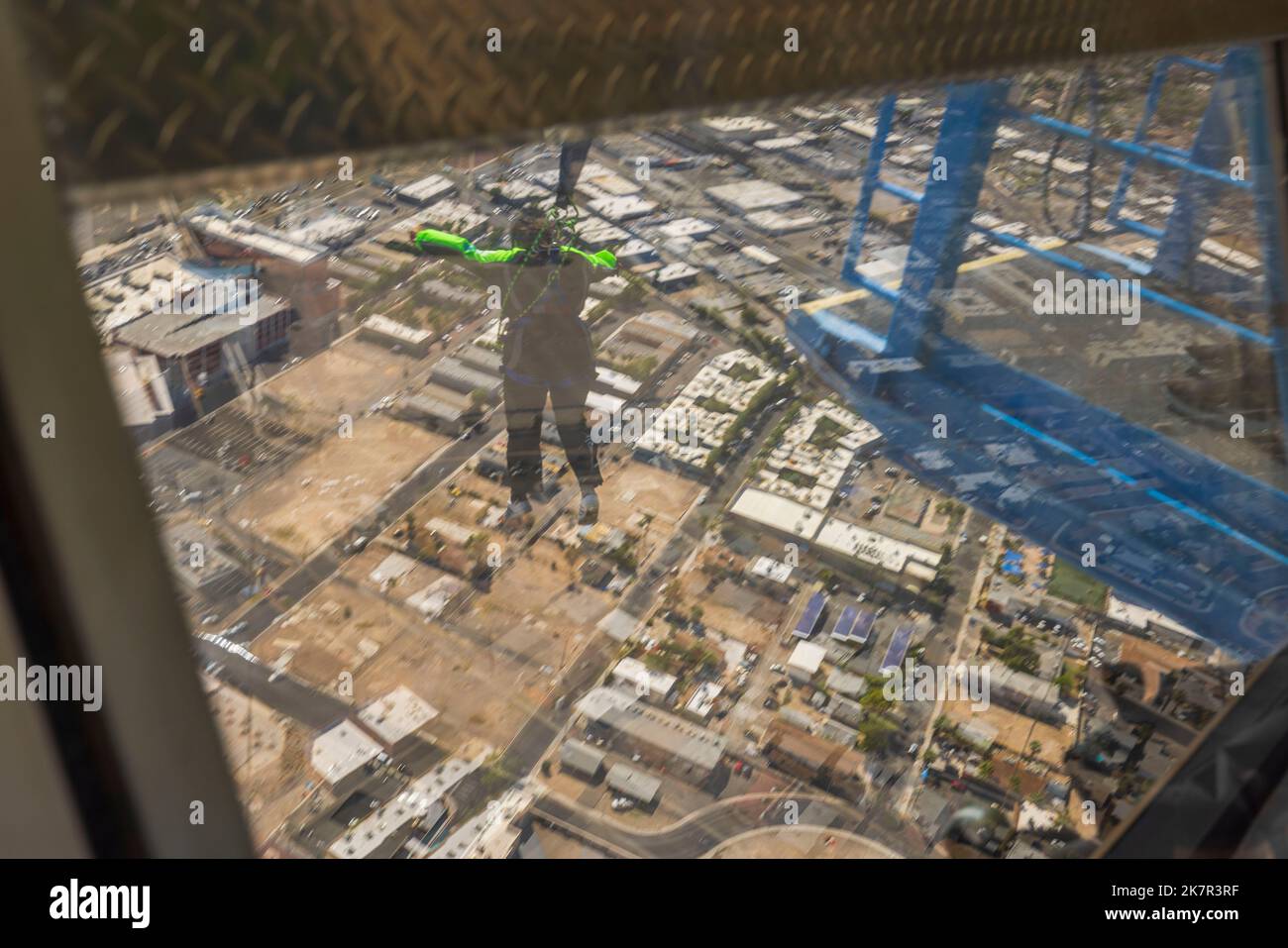 View thorough window on tourist jumping down from Stratosphere. Las ...