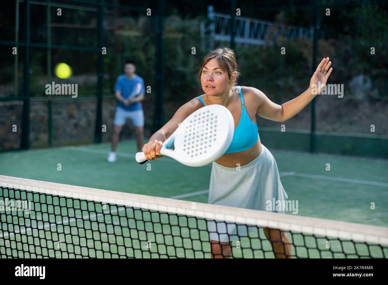 Attractive woman padel tennis player training on court Stock Photo - Alamy