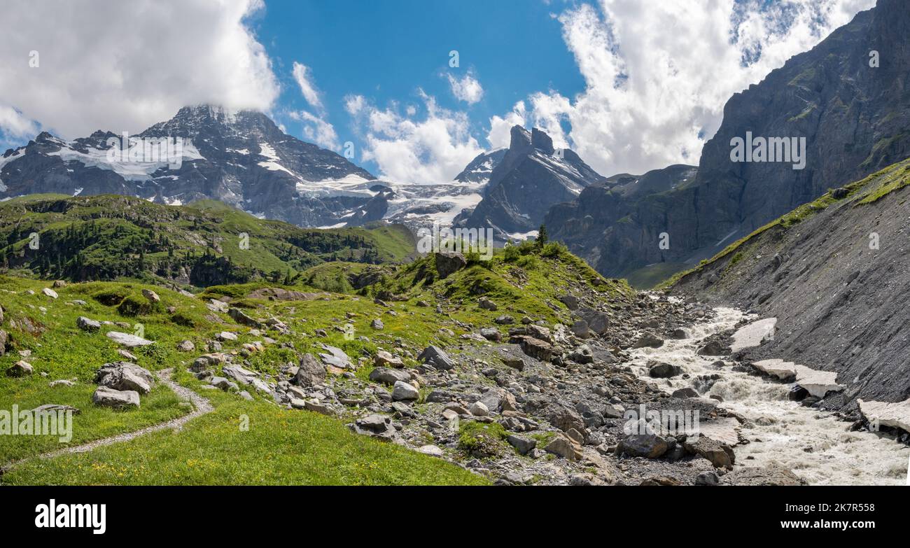 The glacial stream with the Breithorn and Wetterlucke peaks in the ...