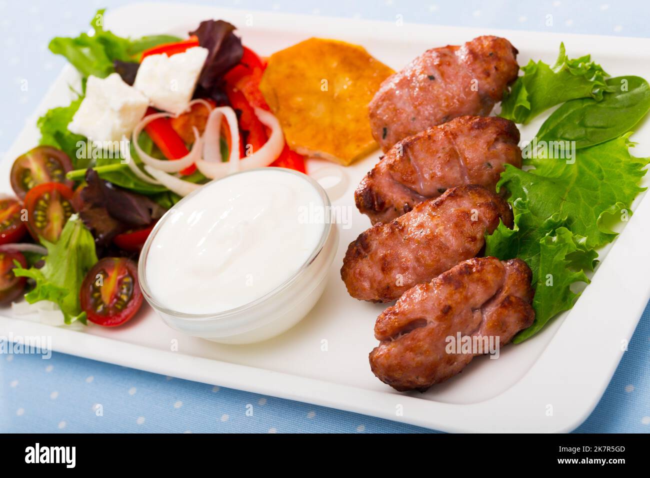 Kebapcheta served with salad Stock Photo - Alamy