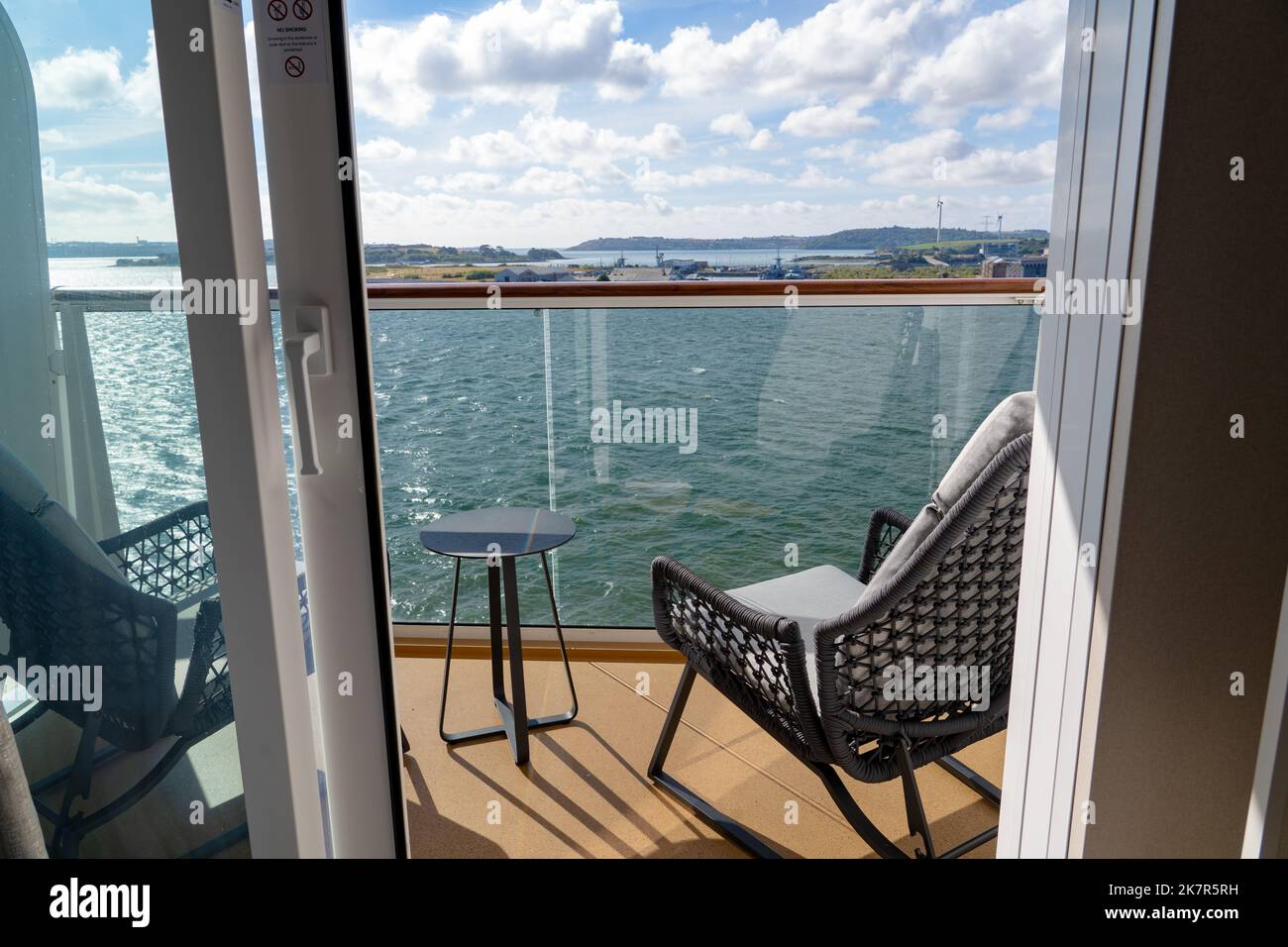 Balcony with chairs, table on cruise ship looking out to ocean Stock ...