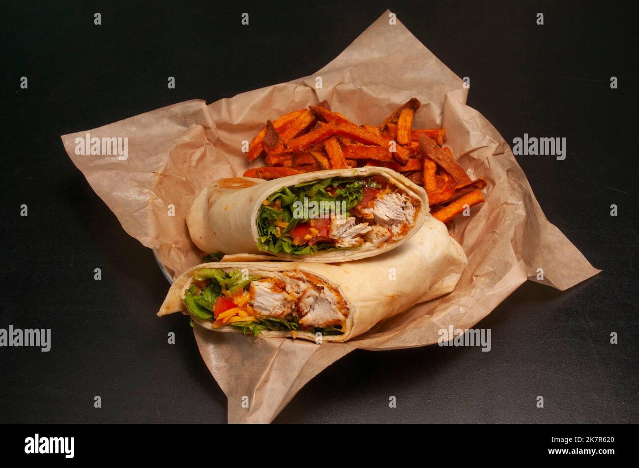 Delicious and nutritious fried chicken and vegetable filled wrap Stock ...
