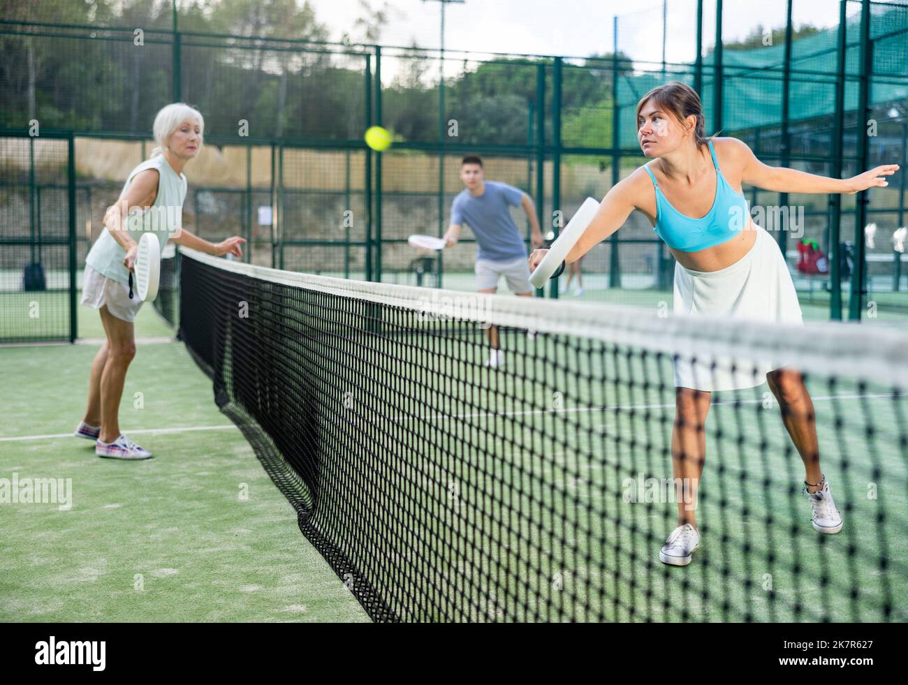Women playing padel tennis on court Stock Photo - Alamy