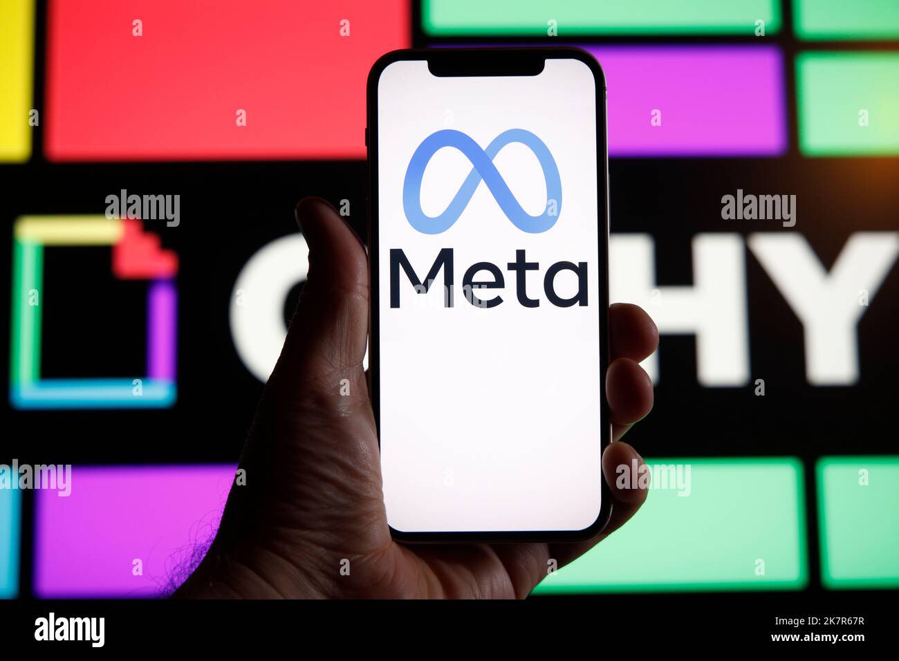 The Meta logo is seen with the Giphy logo in the background in this ...