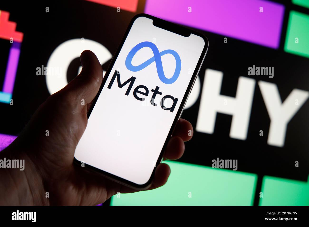The Meta logo is seen with the Giphy logo in the background in this ...