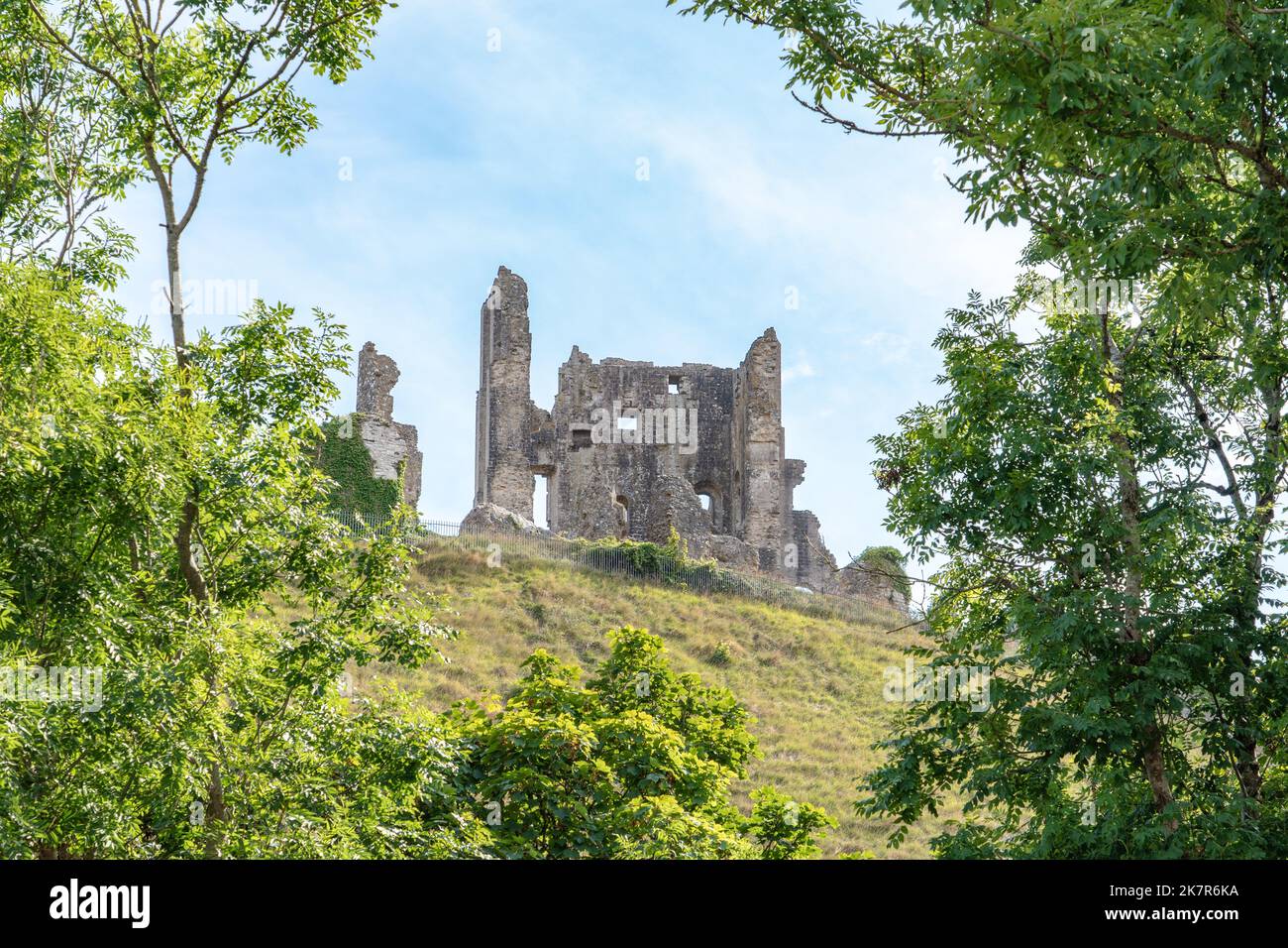 Corfe castle ruins overlook quaint village in Southern England Stock ...