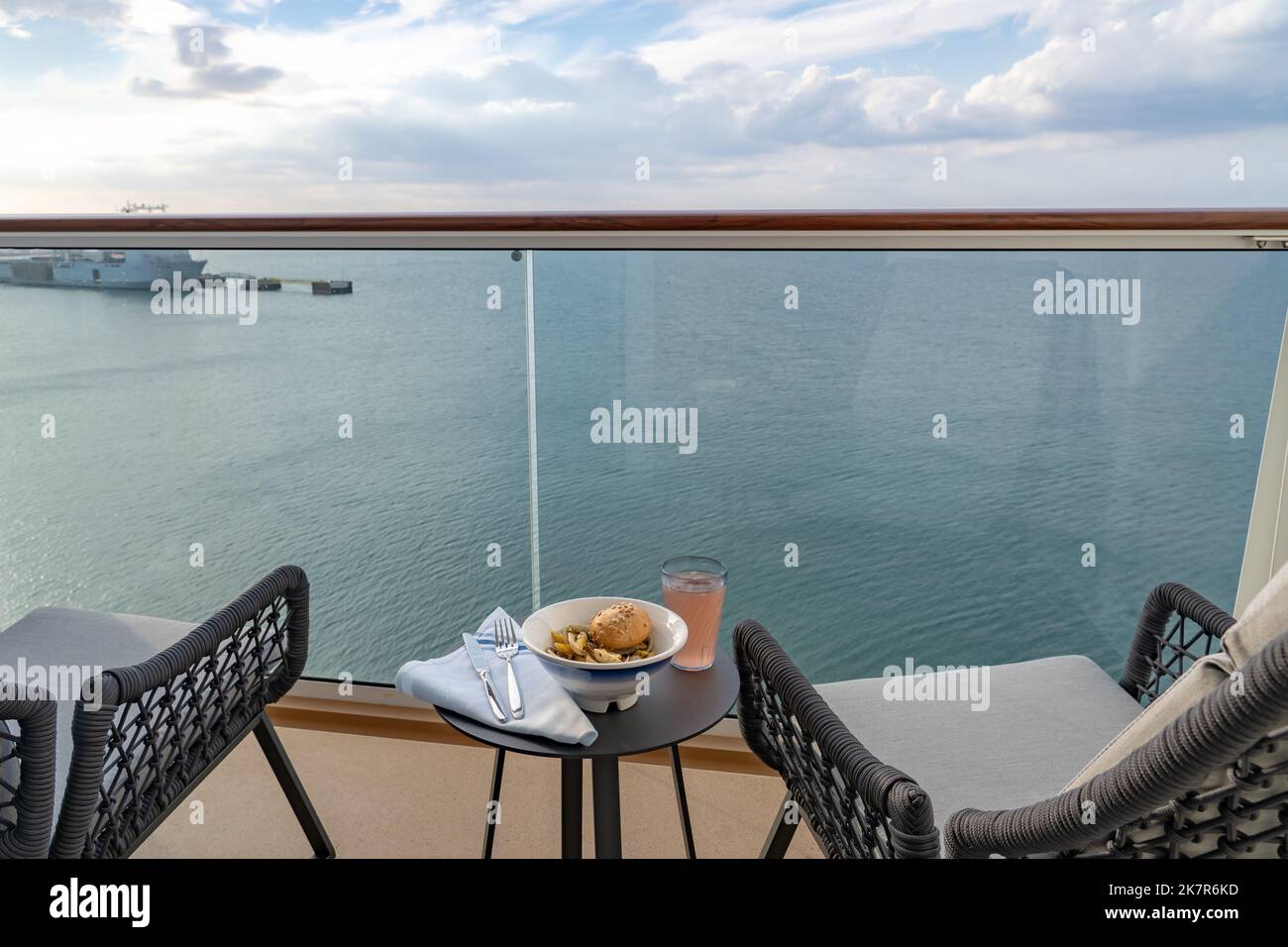 Balcony with chairs, table on cruise ship looking out to ocean Stock ...