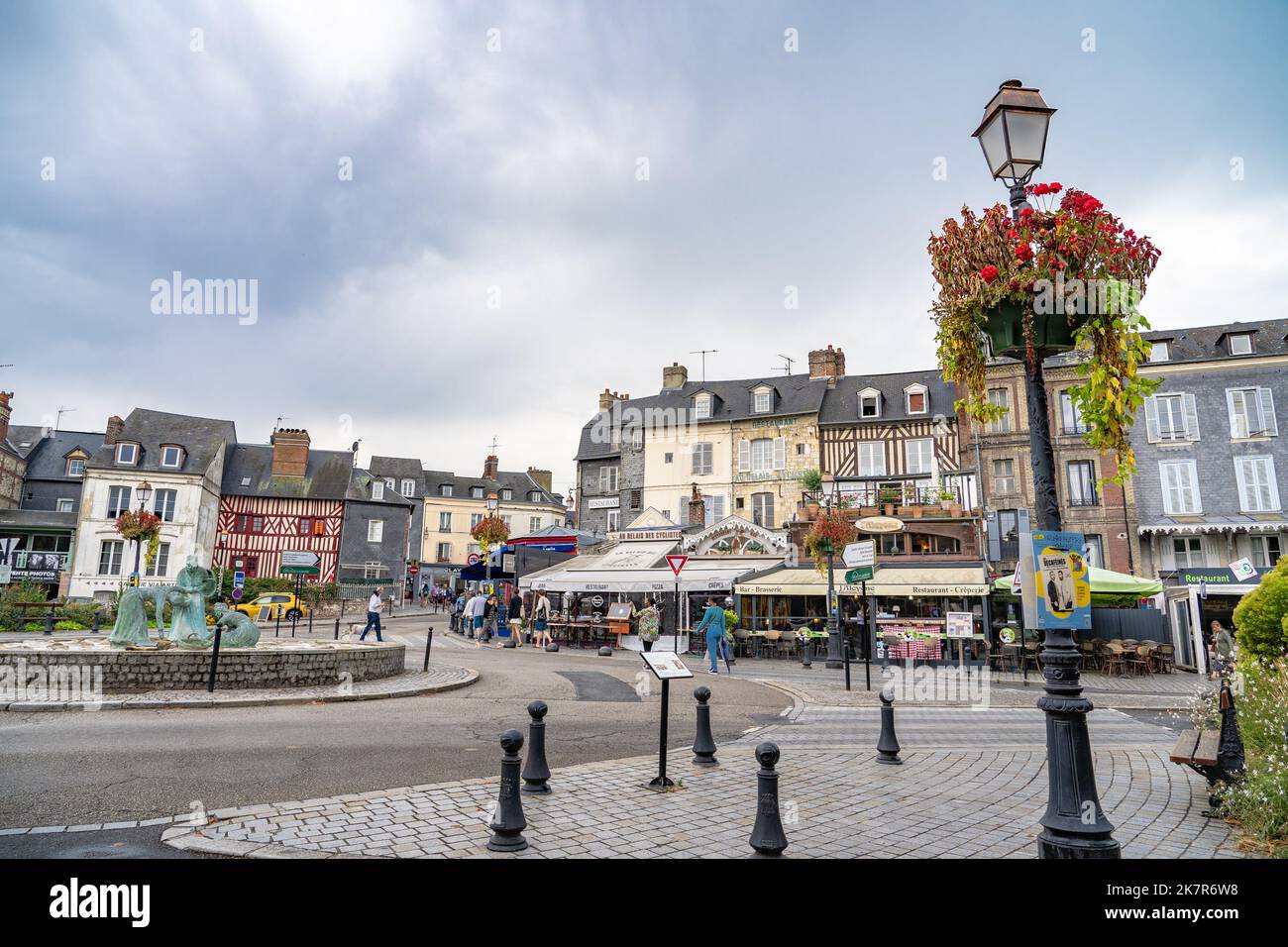 Scenic village of Honfleur, France has colorful, homes, restaurants ...