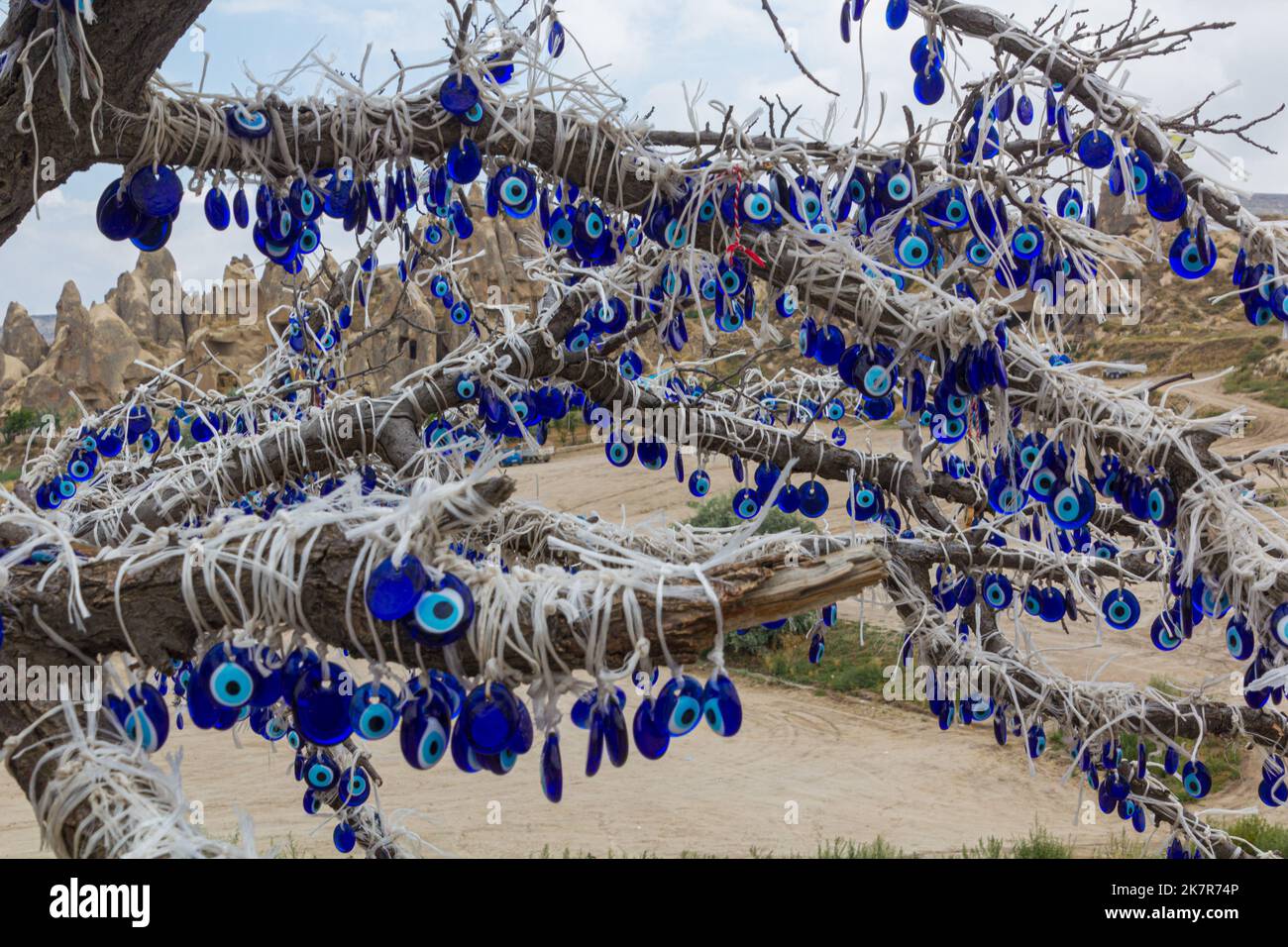 Evil eye amulets on a tree near Goreme town in Cappadocia, Turkey Stock ...