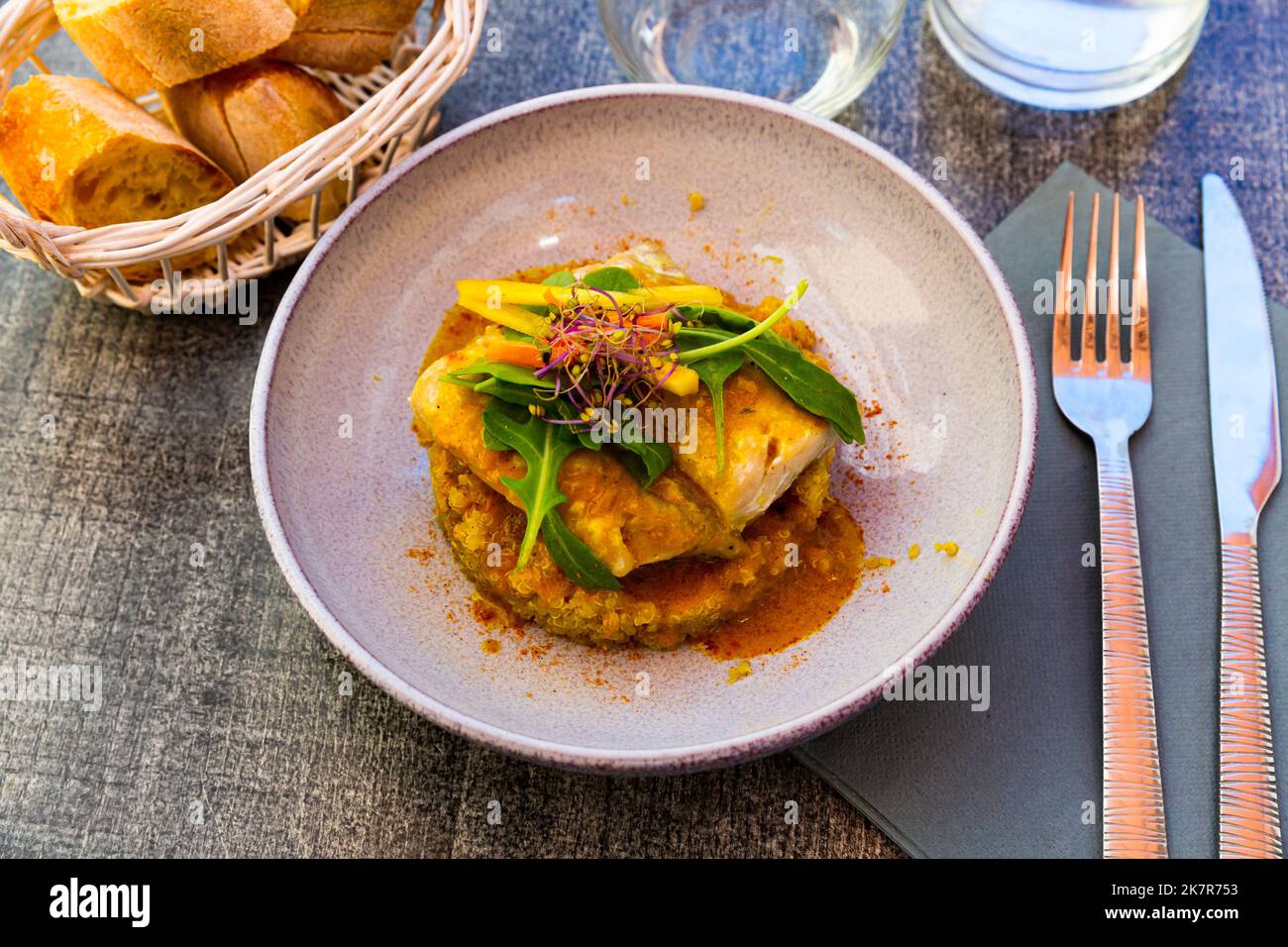 Fried pollock fillet with quinoa, curry and vegetables Stock Photo - Alamy
