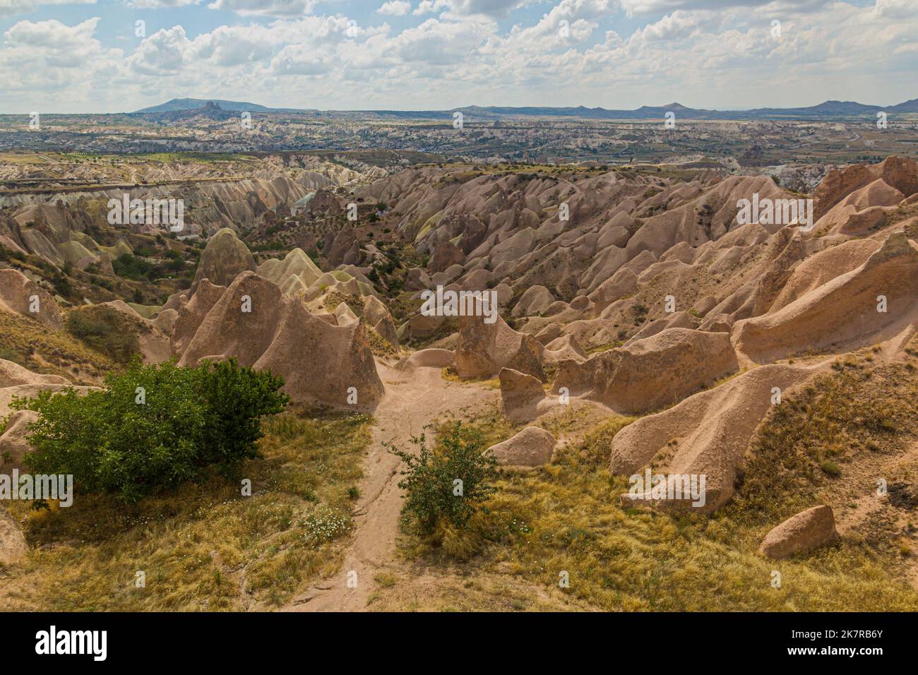View of rock formations Fairy Chimneys of the Red valley in Cappadocia ...