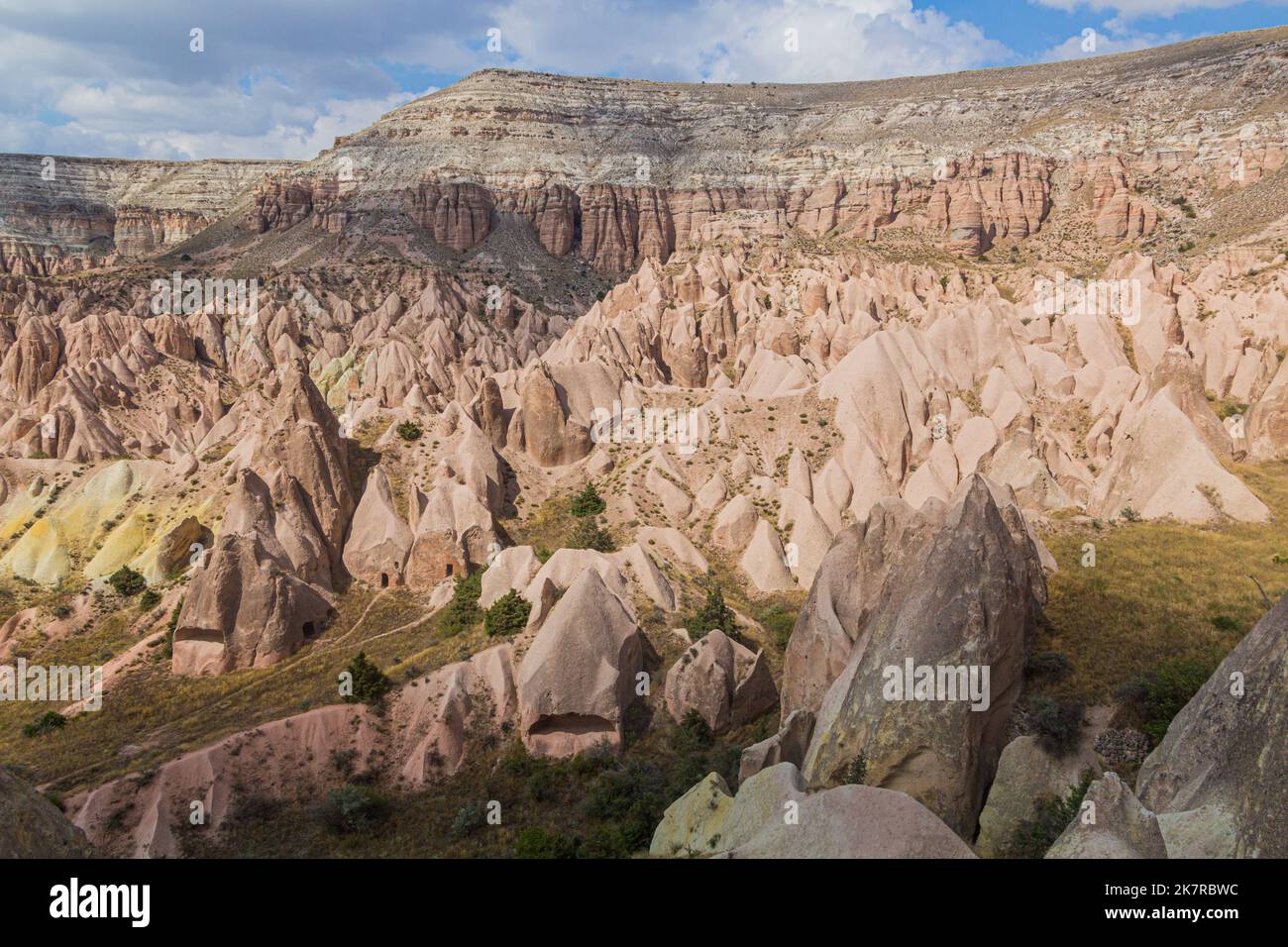 View of rock formations Fairy Chimneys of the Red valley in Cappadocia ...