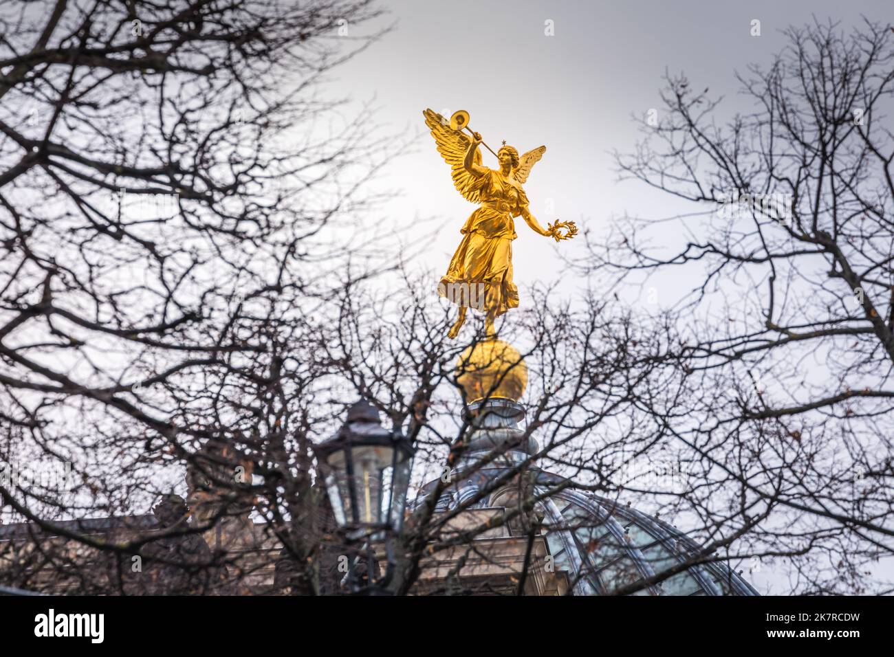 Golden angel on the dome of the Academy of Art in Dresden at evening ...
