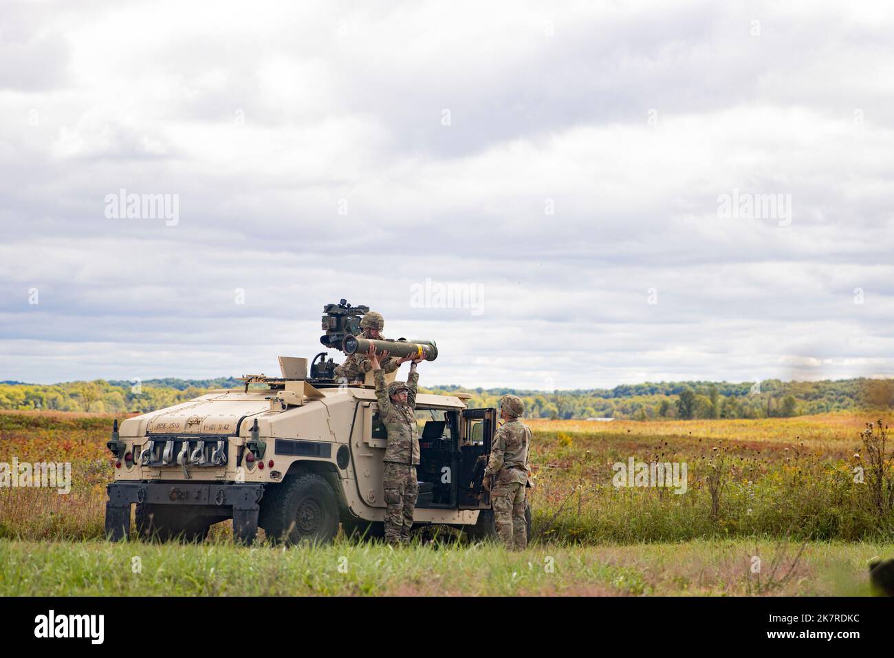 Range safety Sgt. Brant Watkins supervises while Spc. Rudy De La Cruz ...