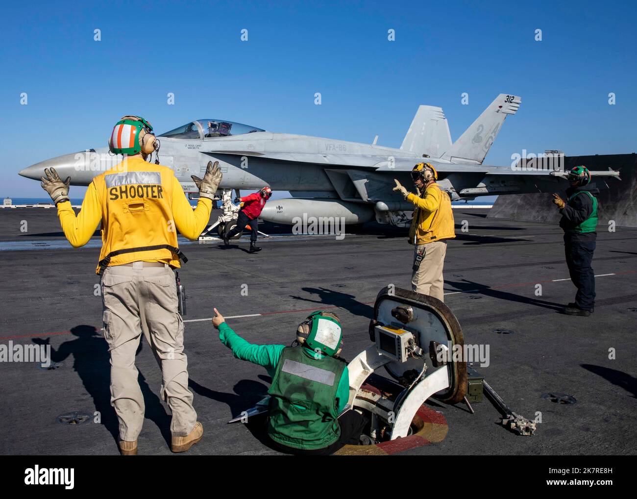 221018-N-ZG822-2198 ADRIATIC SEA (Oct. 18, 2022) Sailors signal an F/A ...