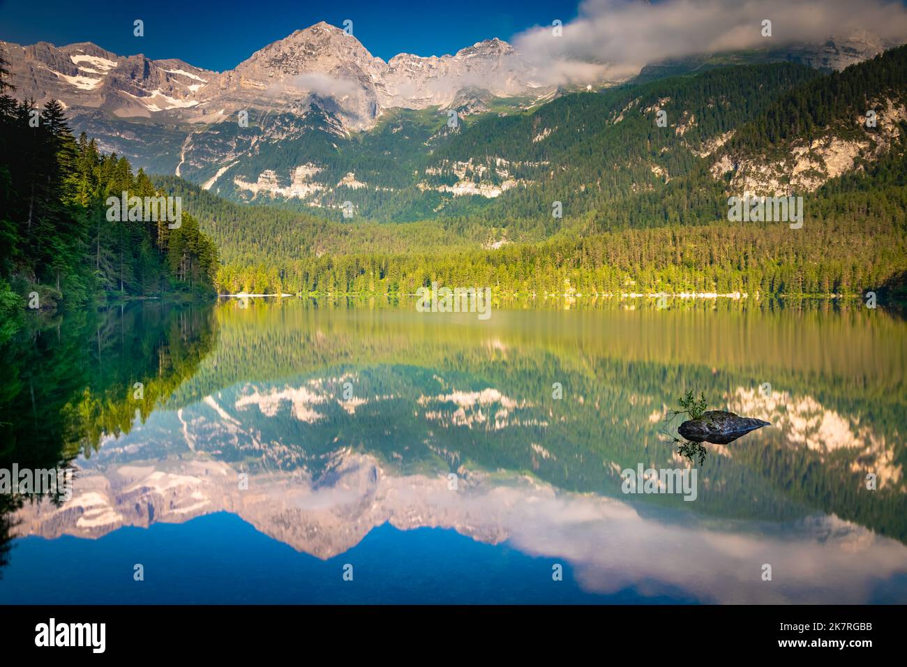 Lake Tovel reflection symmetry in Trentino-Alto Adige, Dolomites, Italy ...