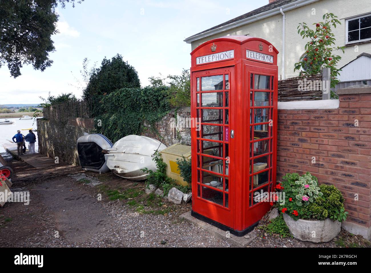 Old telephone box being used as a library, Topsham, Devon Stock Photo ...