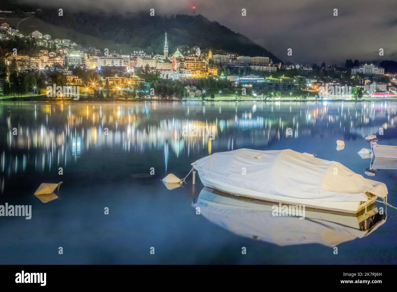 St Moritz cityscape and lake reflection at night, Engadine, Swiss alps ...