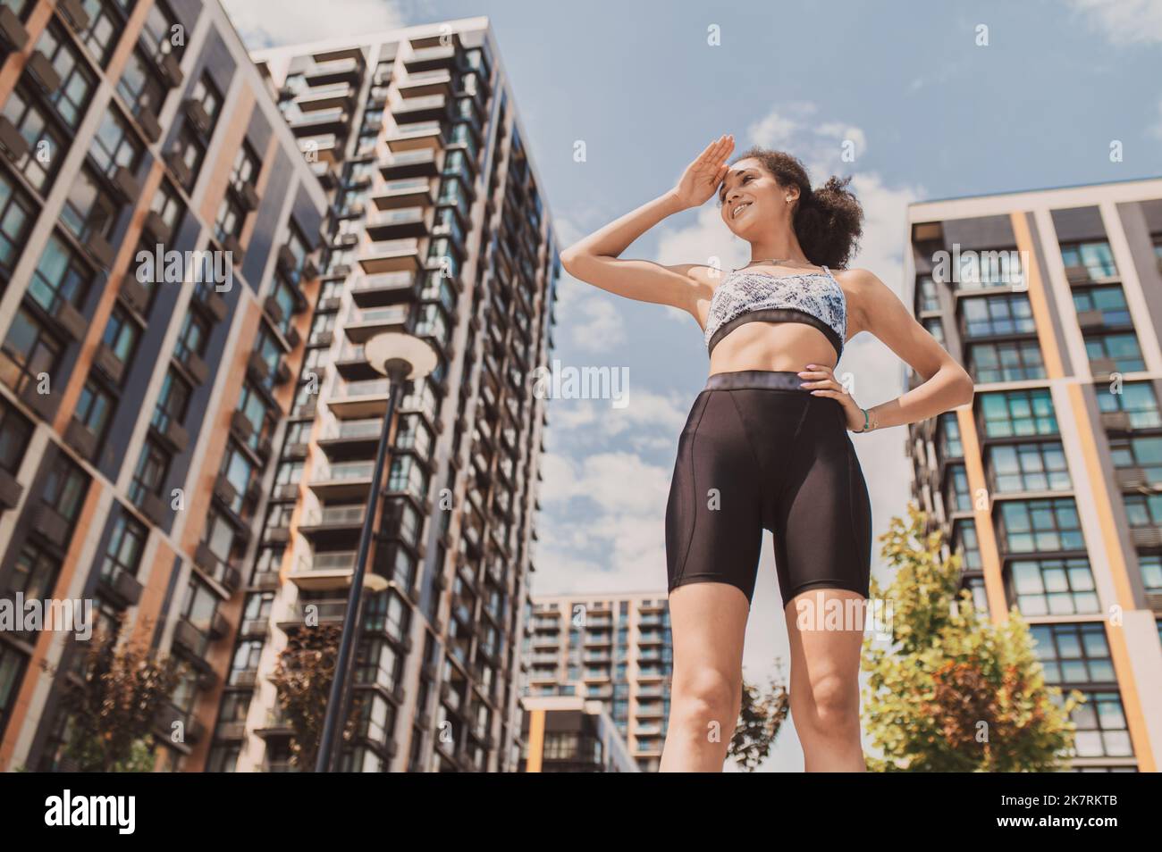 Well-built sportive girl in sportswear looking confident Stock Photo ...