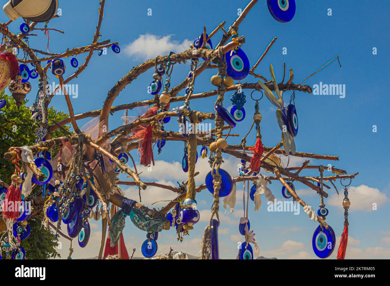 Evil eye amulets on a tree near Goreme town in Cappadocia, Turkey Stock ...