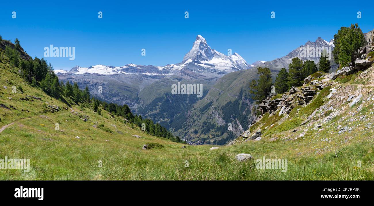 The panorama of swiss walliser alps with the Matterhorn peak over the ...