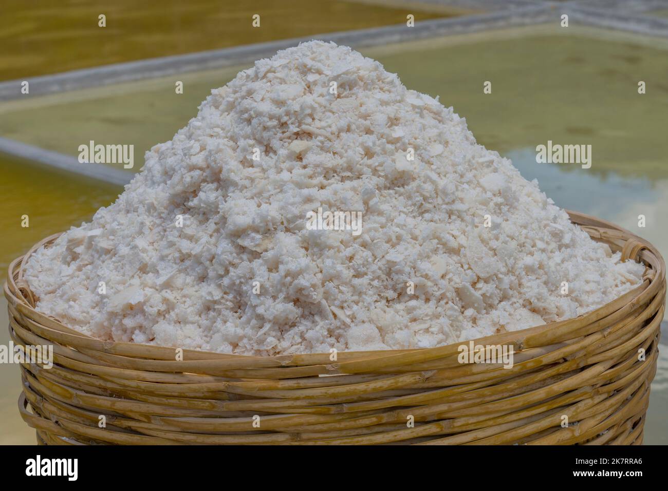 Salt is drying in baskets on the side of the saline pools at a salt ...