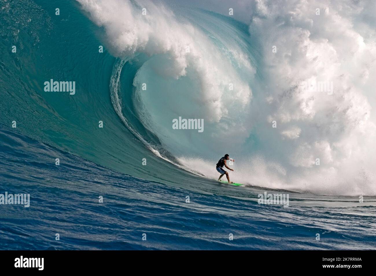 Tow-in surfer drops to the curl of Hawaii's big surf at Peahi (Jaws ...