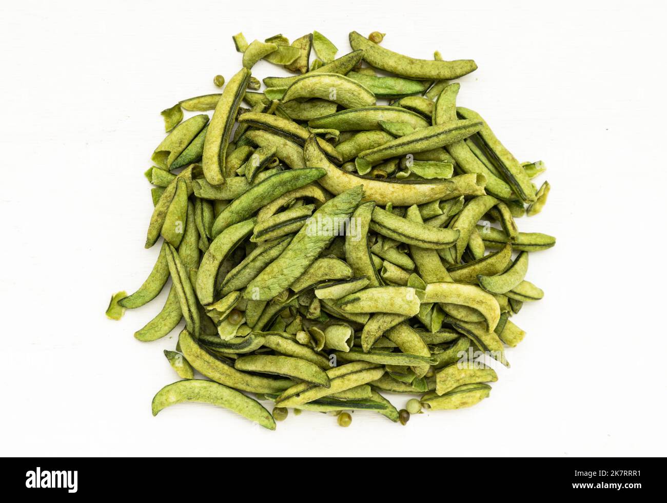 A lot of Healthy roasted sugar snap peas on white background. Top view ...