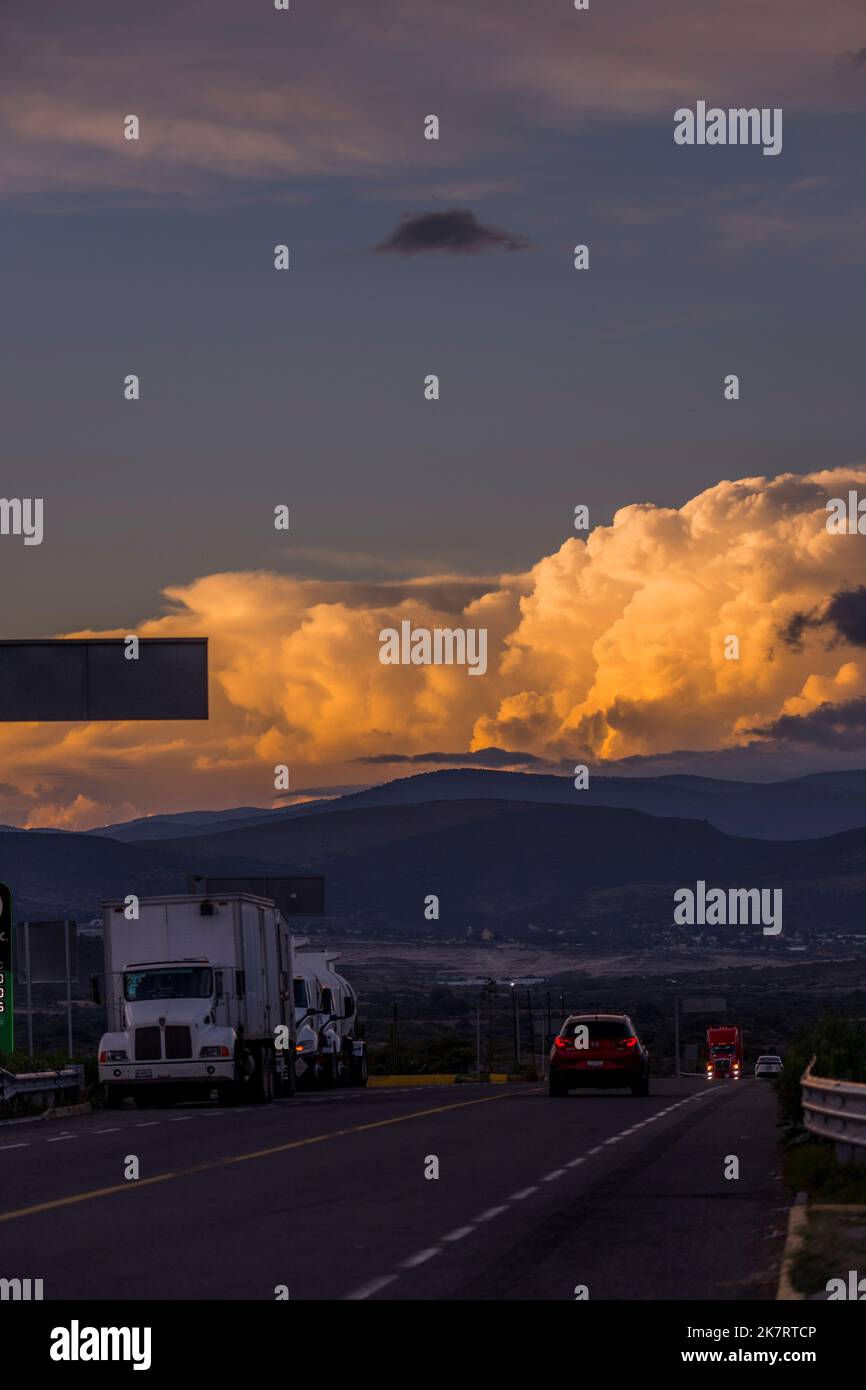 Thunderstorm clouds (cumulonimbus) over the Mexican Federal Highway 135 ...