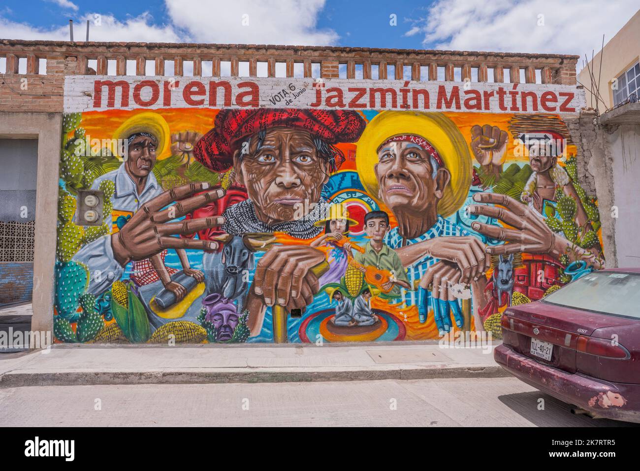 A street scene with a colorful mural in Mitla, a small town in the ...